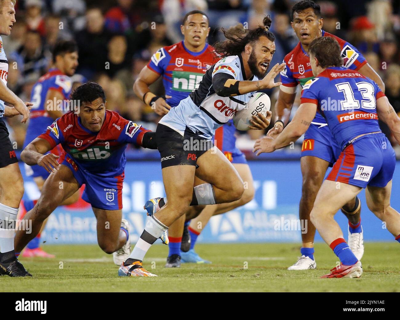 Toby Rudolph of the Sharks is tackled during the Round 6 NRL match ...
