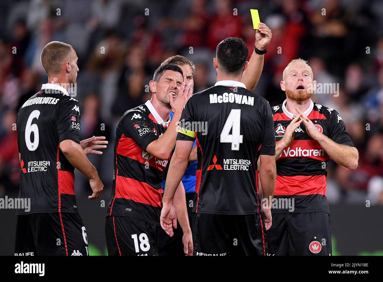 Ziggy Gordon of the Wanderers (right) reacts after being shown a yellow ...