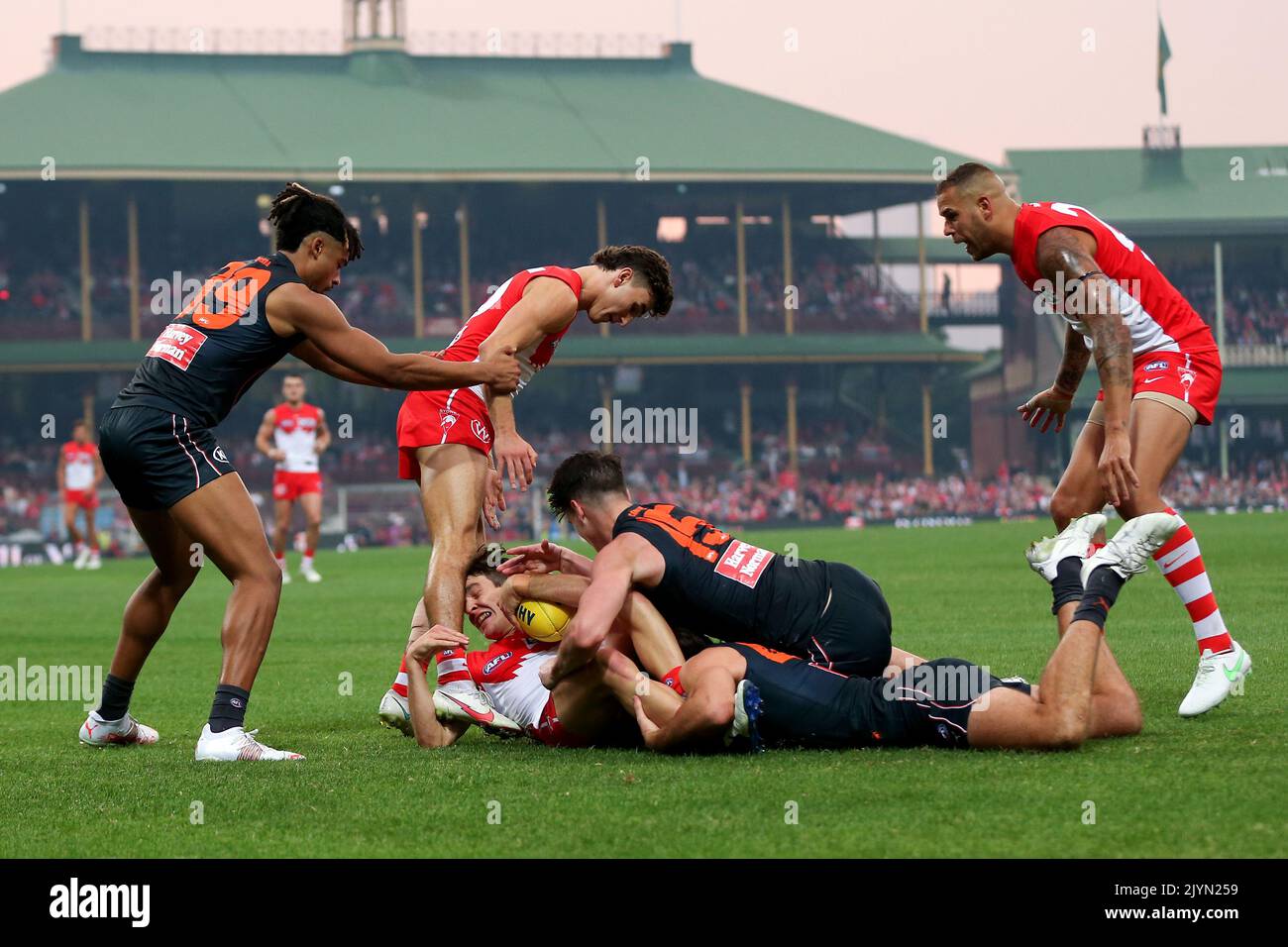 Errol Gulden of the Swans contests the ball with Samuel Taylor of the ...