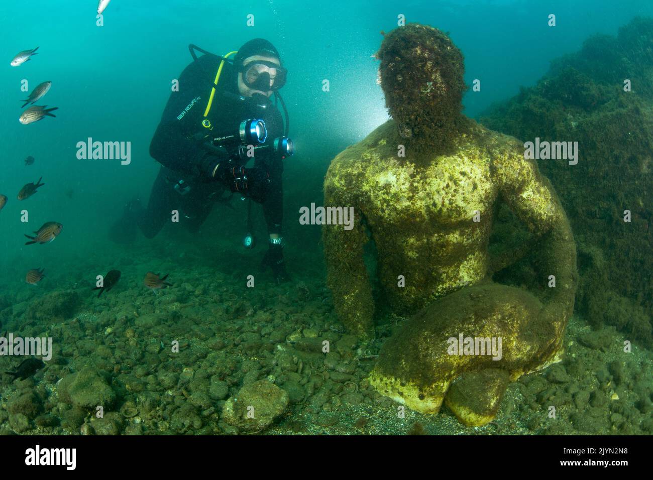 Scuba diver with statue depicting a companion of Ulysses (perhaps Baio ...