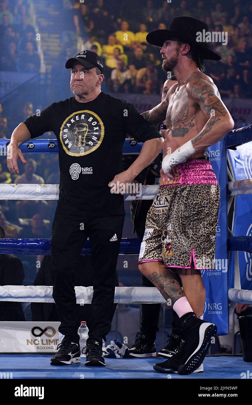 Jack Brubaker right and his trainer Jeff Fenech watch on after he was ...