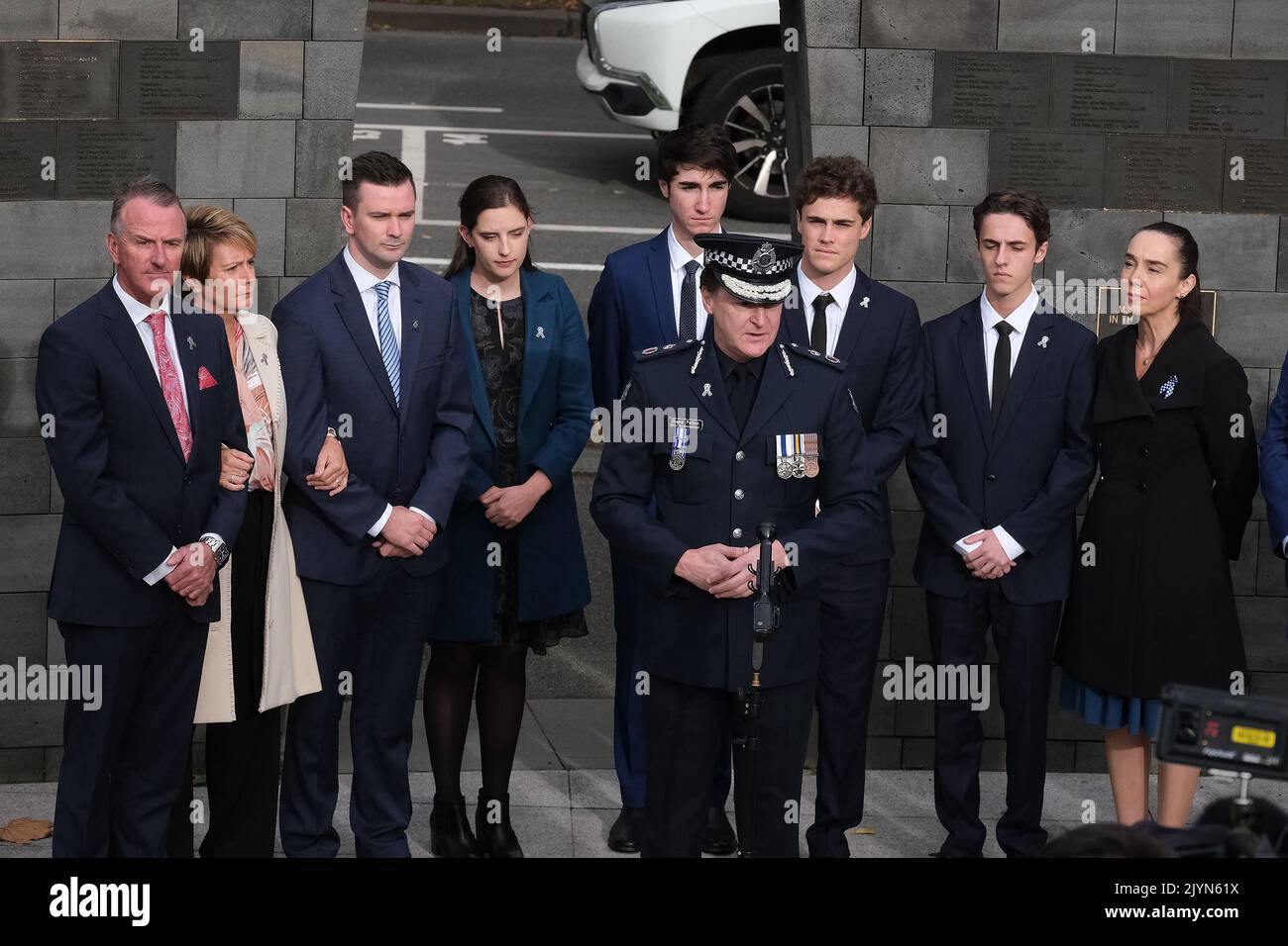 Chief Commissioner Shane Patton is seen with the family of police ...