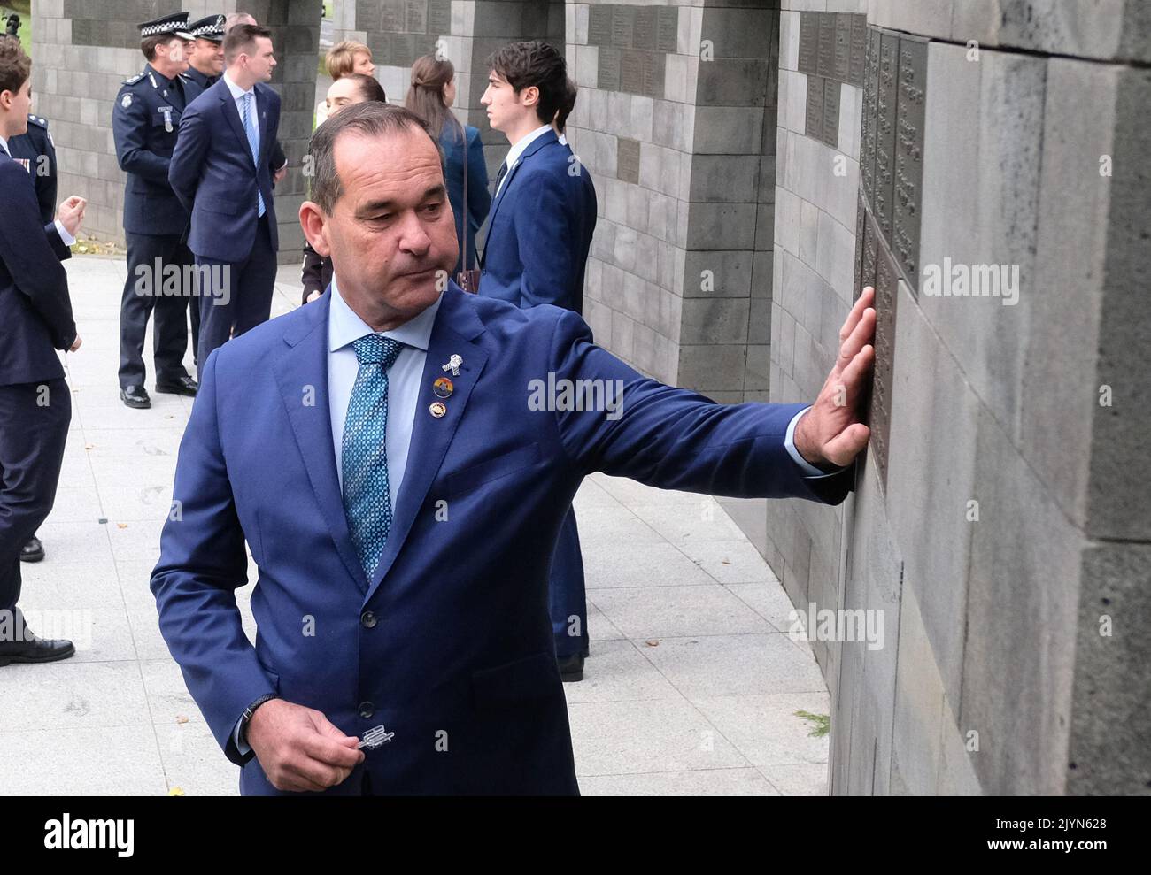 Partner of Constable Glen Humphris, Todd Robinson, attends a flower ...