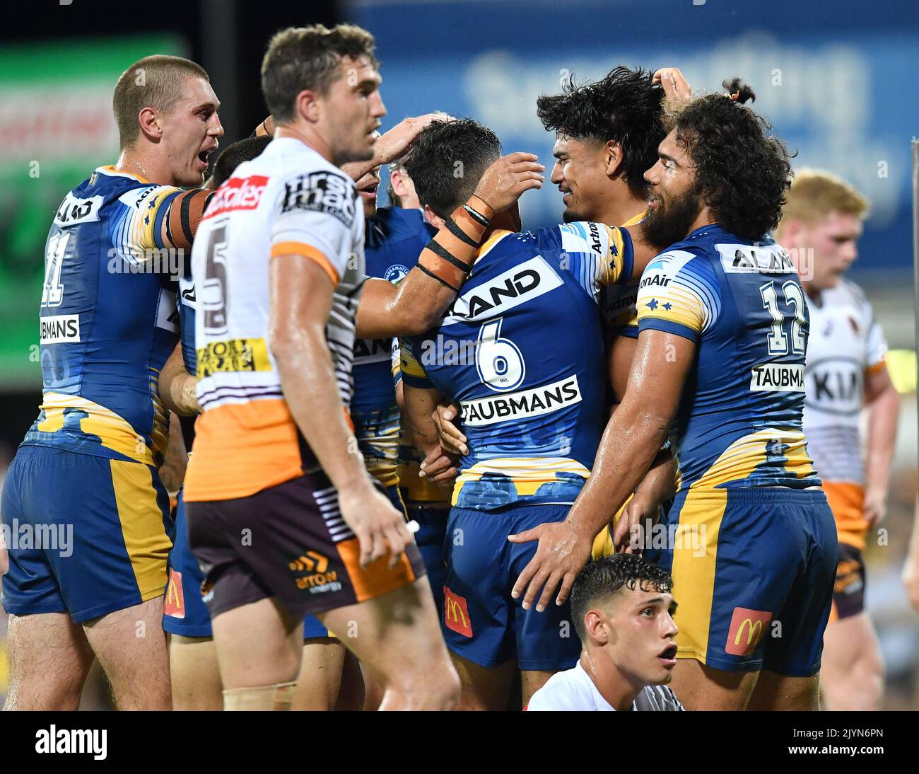 Oregon Kaufusi (centre) of the Eels celebrates scoring a try with team ...