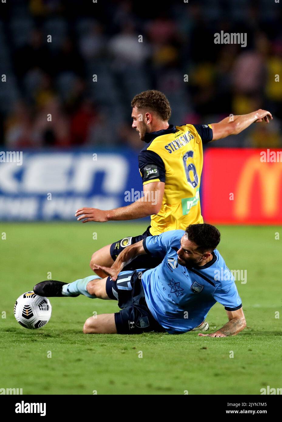 Anthony Caceres of Sydney competes with Gianni Stensness of the ...