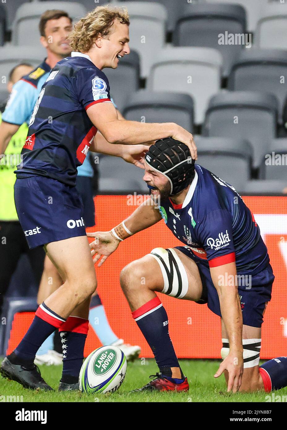 Michael Wells (R) from the Melbourne Rebels celebrates with team mates ...