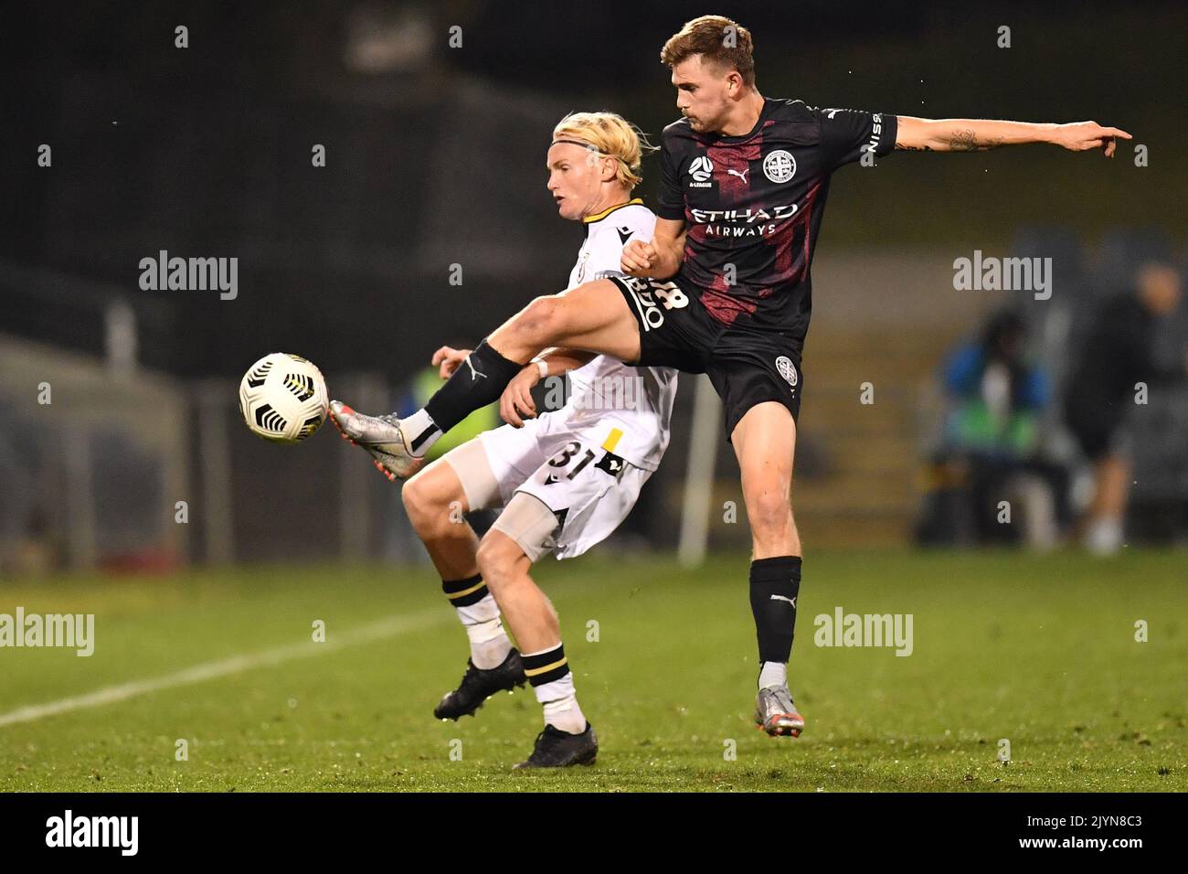 Connor Metcalfe of Melbourne City and Lachlan Rose of Macarthur during ...