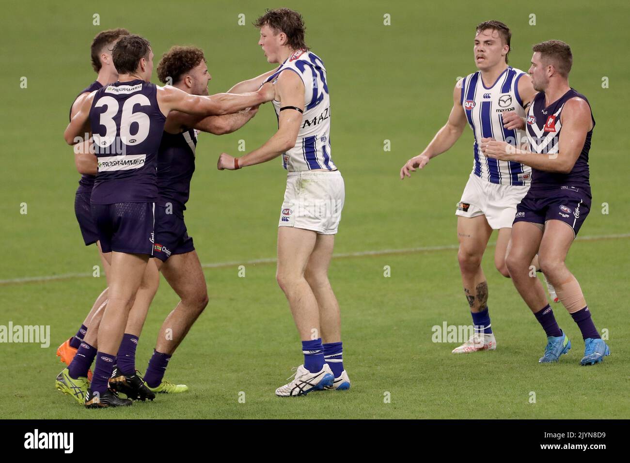 Griffin Logue of the Dockers and Nick Larkey of the Kangaroos scuffle ...