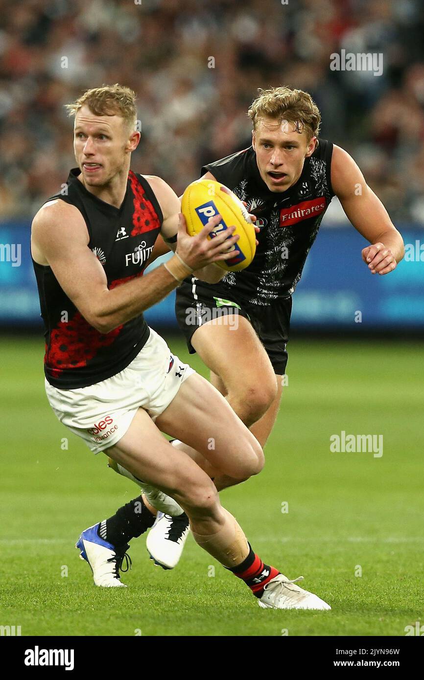 Nick Hind of the Bombers runs with the ball during the Round 6 AFL ...