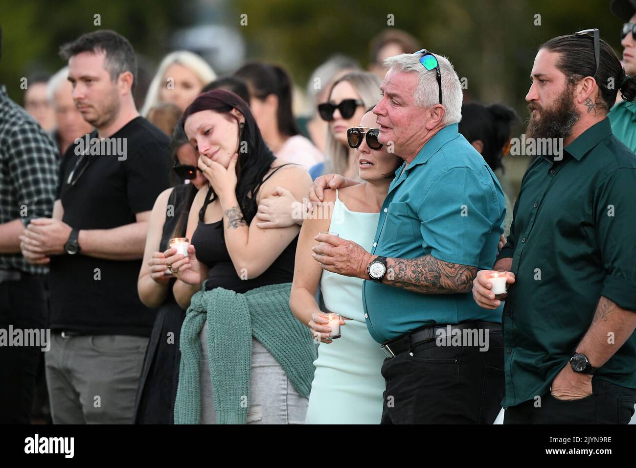 The family of Kelly Wilkinson are seen during a vigil for murdered ...
