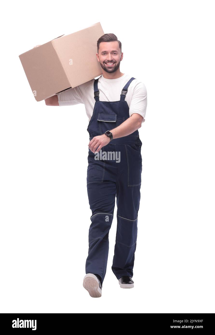 in full growth. smiling man carries a large cardboard box Stock Photo ...
