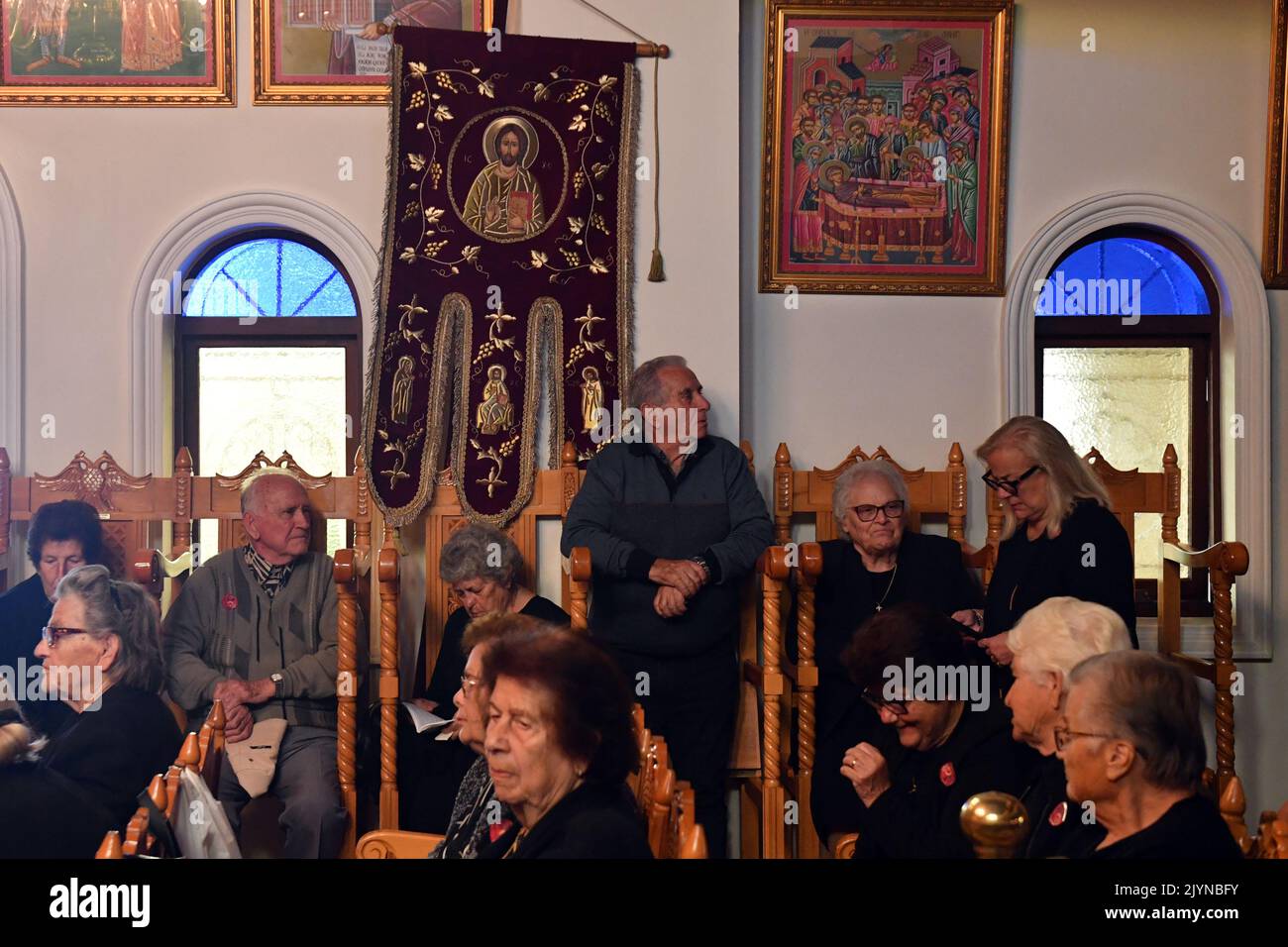 Worshippers during a Good Friday service at Greek Orthodox Church of St ...