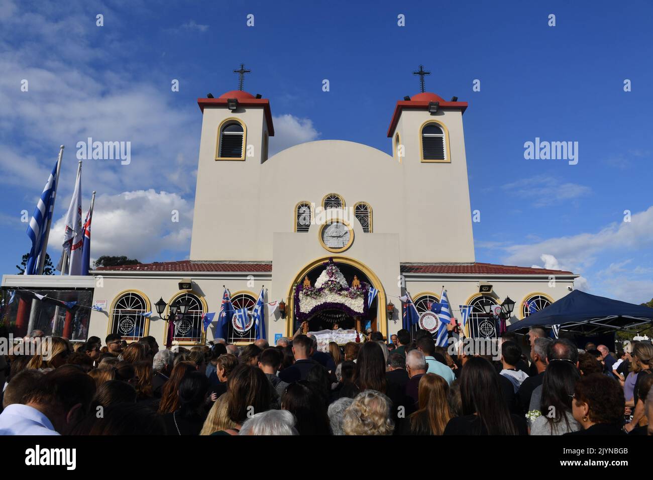 Worshippers wait to go under the Epitaphio (the symbolic funeral bier ...