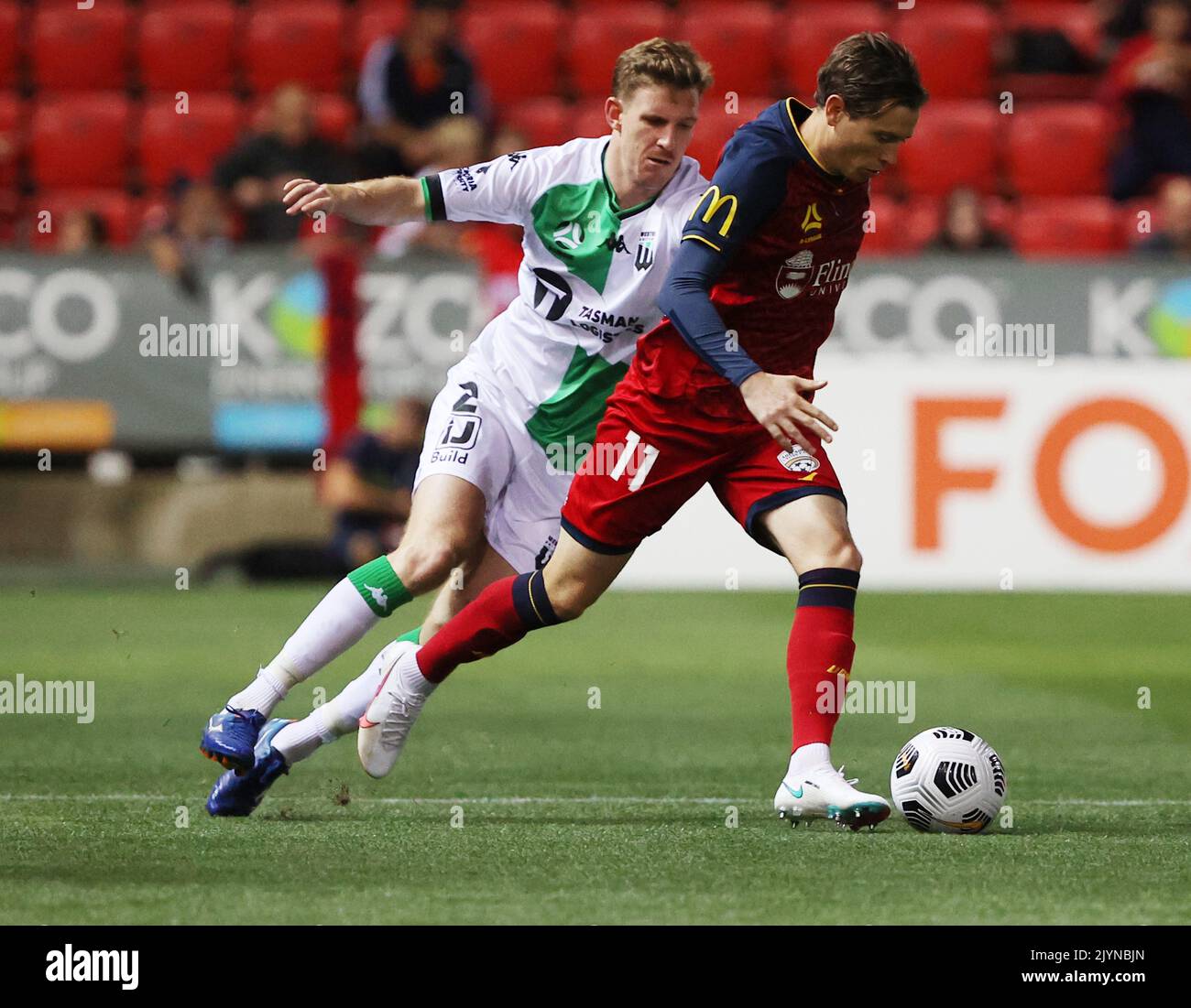 Aaron Calver from Western United and Craig Goodwin of United during the ...