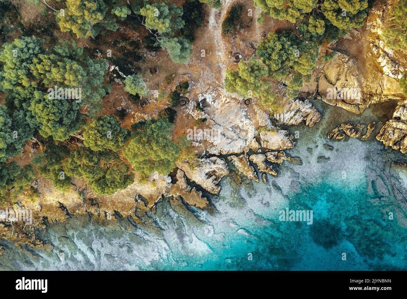 Aerial top-down view exotic beach with turquoise seawater, white rocks ...