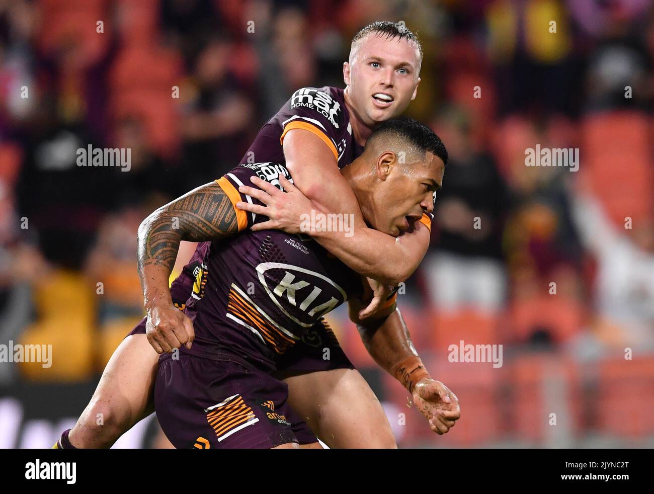 Jamayne Isaako of the Broncos celebrates scoring a try with Jake Turpin ...