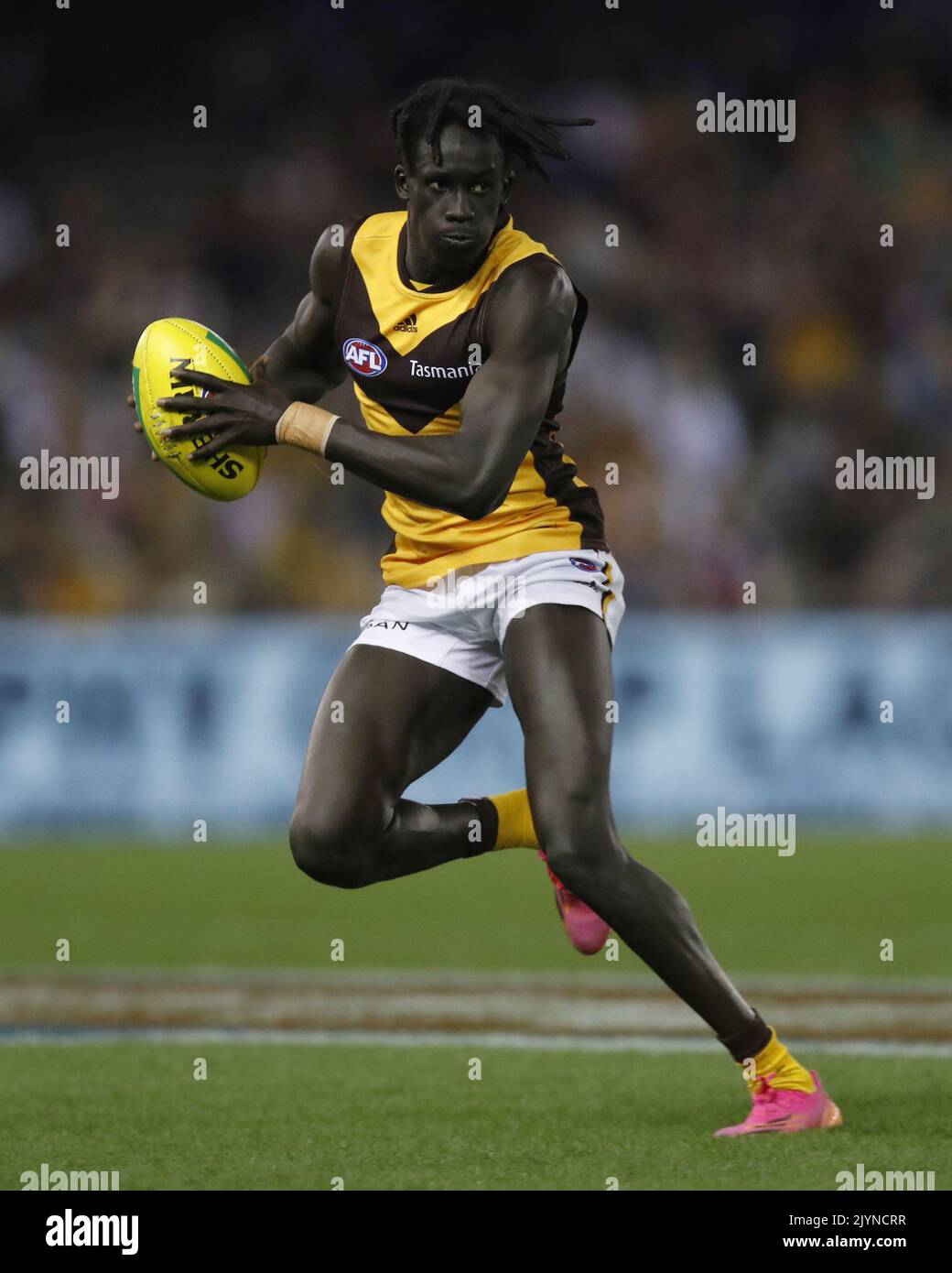 Changkuoth Jiath of the Hawks runs with the ball during the Round 7 AFL ...