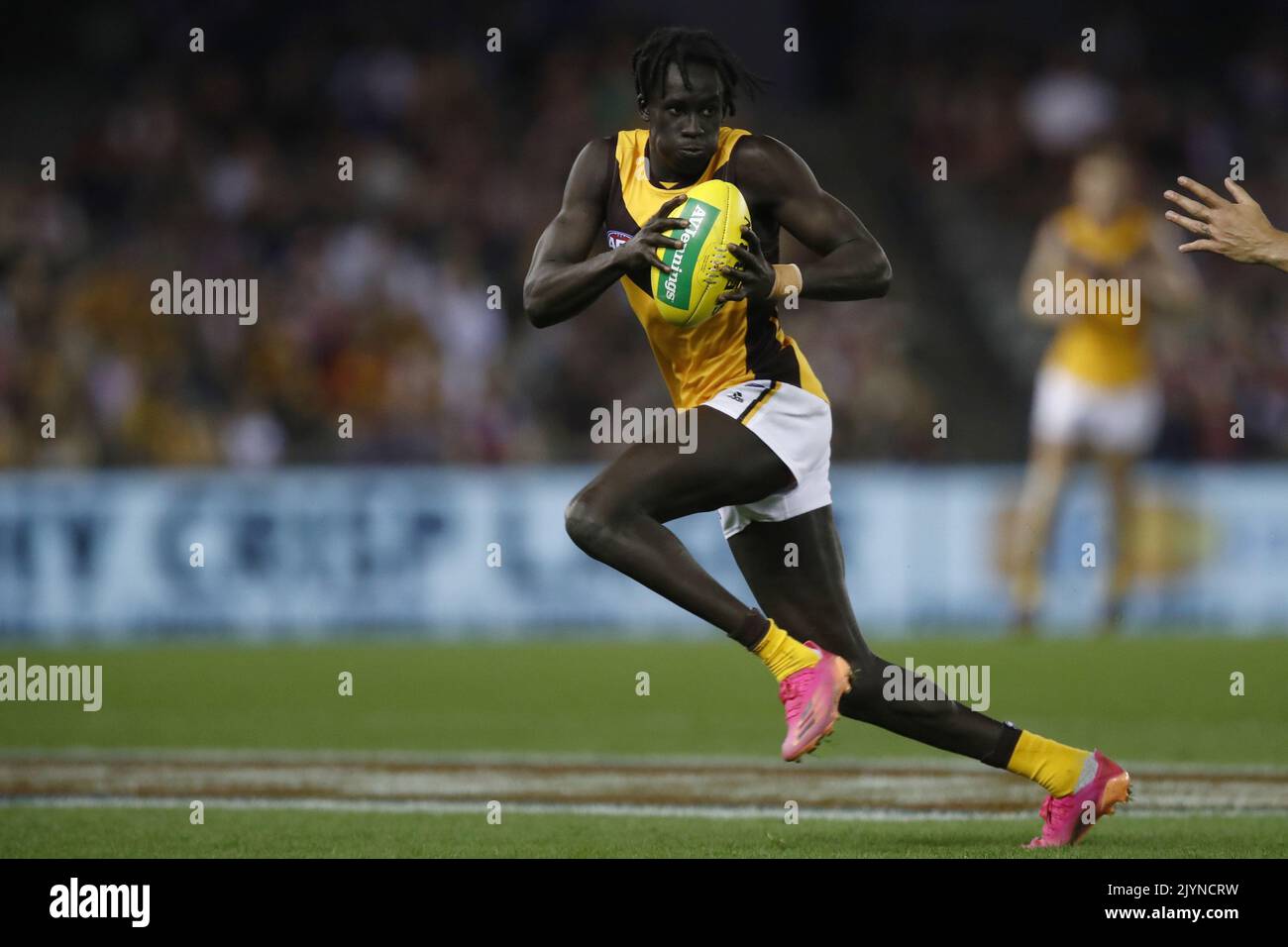 Changkuoth Jiath of the Hawks runs with the ball during the Round 7 AFL ...