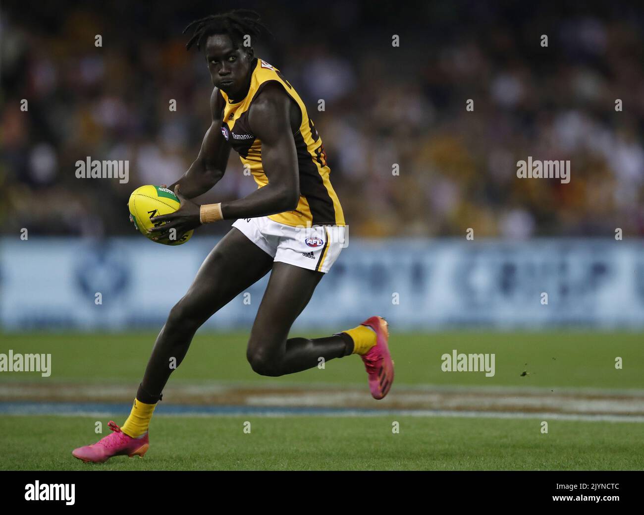 Changkuoth Jiath of the Hawks runs with the ball during the Round 7 AFL ...
