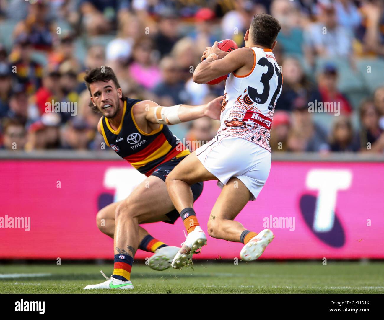 Bobby Hill of the Giants evades Lachlan Murphy of the Crows during the ...
