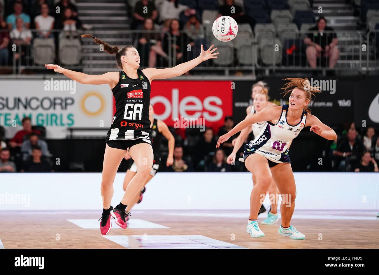 Gabby Sinclair of the Magpies and Steph Wood of the Lightning compete ...