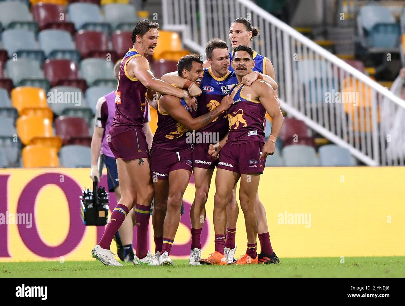 Charlie Cameron of the Lions (right) reacts after kicking a goal during ...