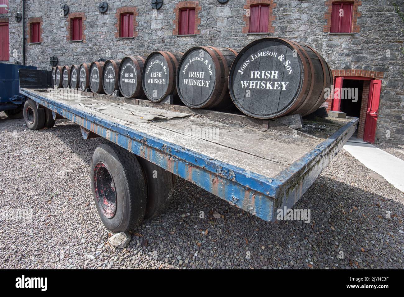 Irish whiskey barrels on a vintage delivery trailer at the Old Midleton ...