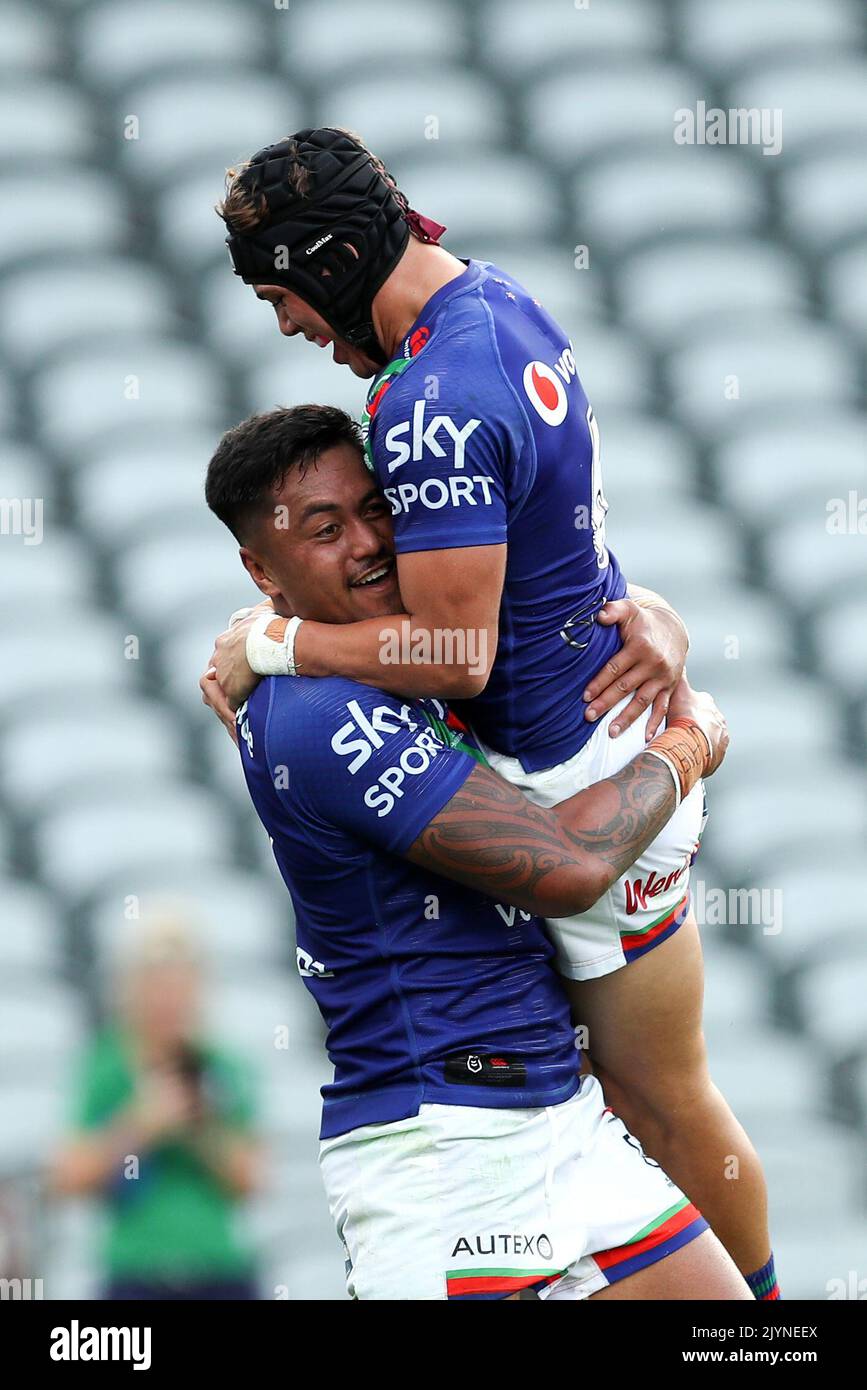Adam Pompey of the Warriors celebrates scoring a try with team mate ...