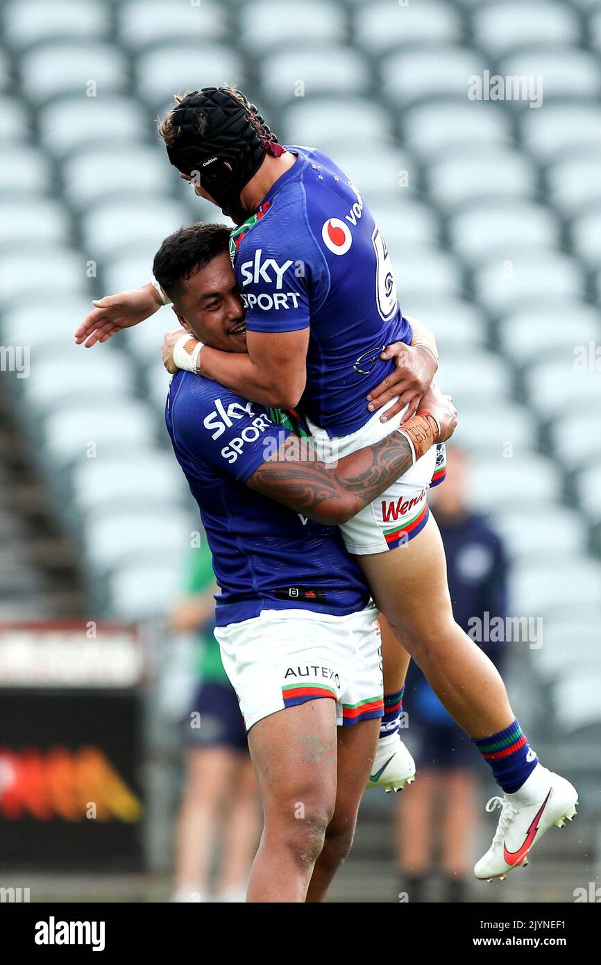Adam Pompey of the Warriors celebrates scoring a try with team mate ...