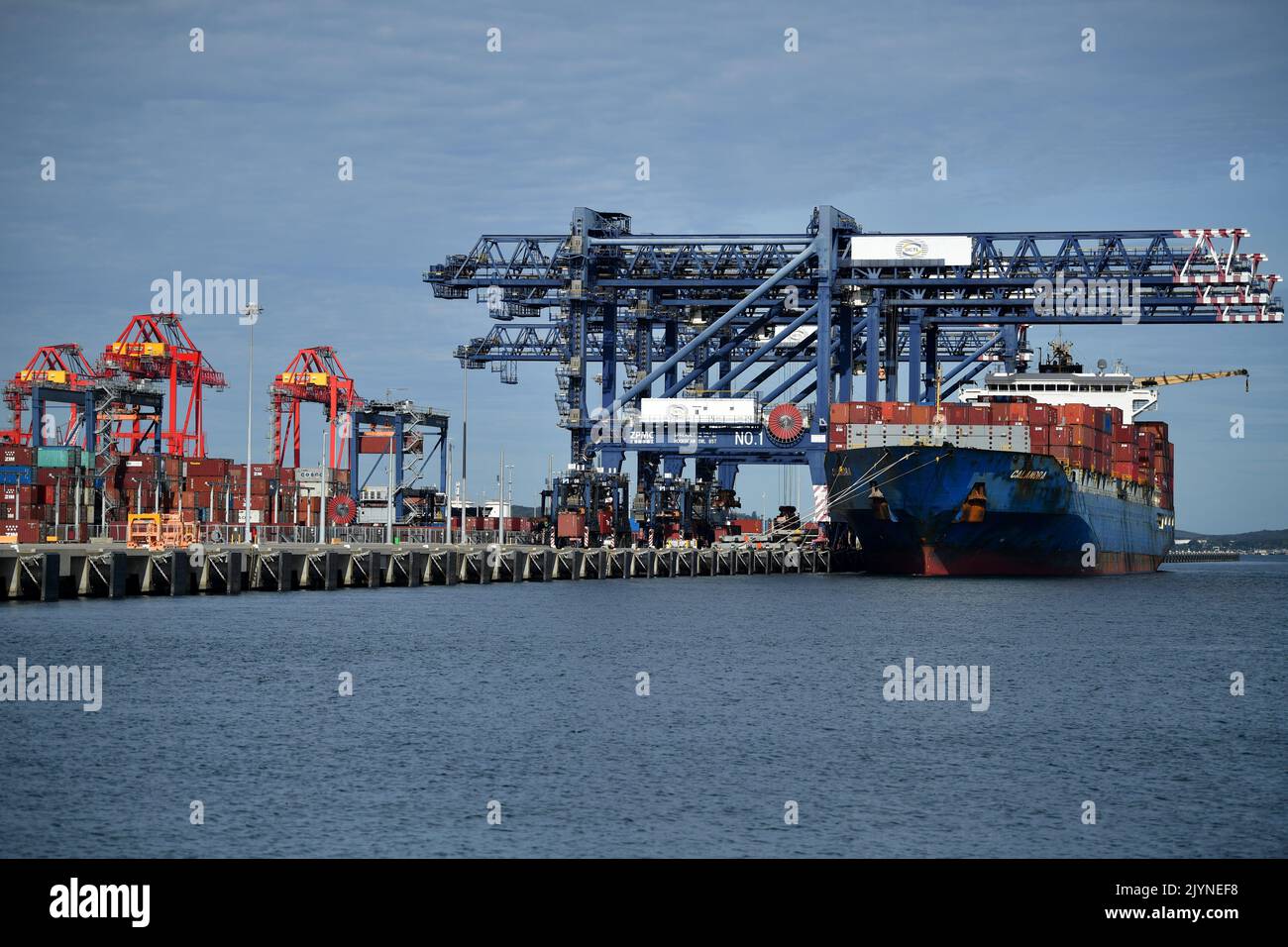 A container ship is unloaded at the Port Botany container terminal in ...