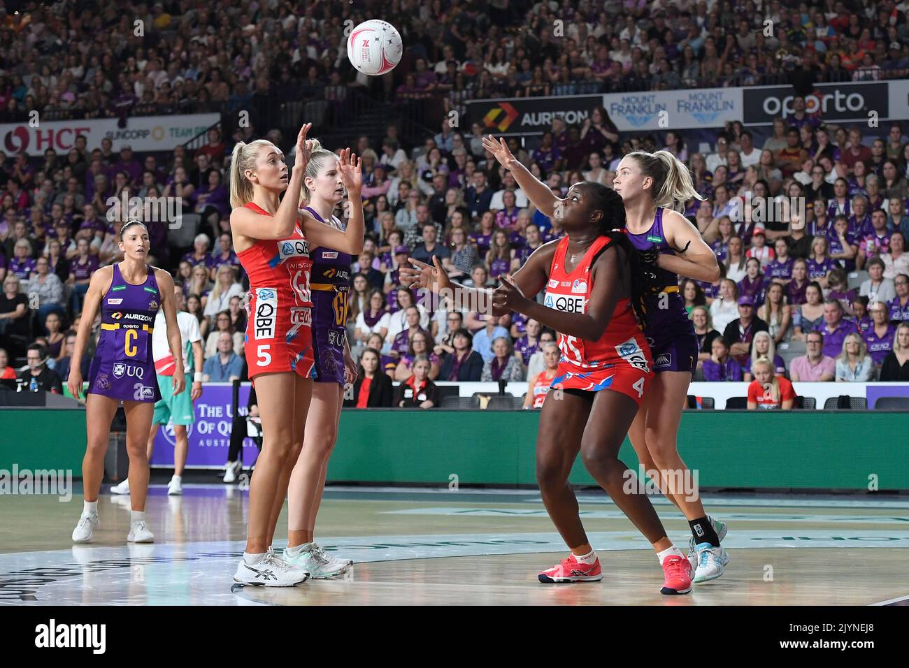 Helen Housby of the Swifts passes the ball to Sam Wallace during the ...