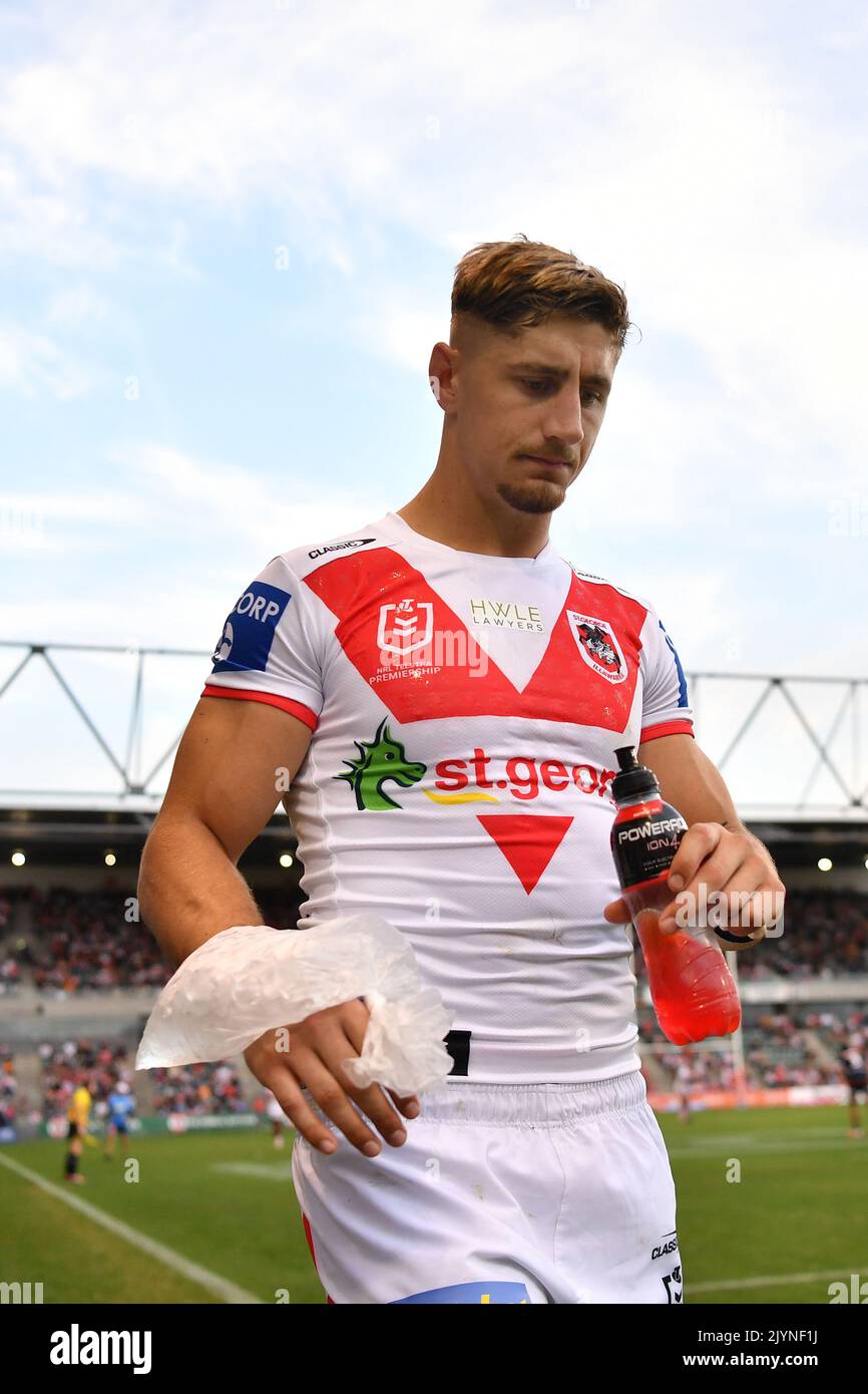 Zac Lomax of the Dragons leaves the field with his hand in ice during ...