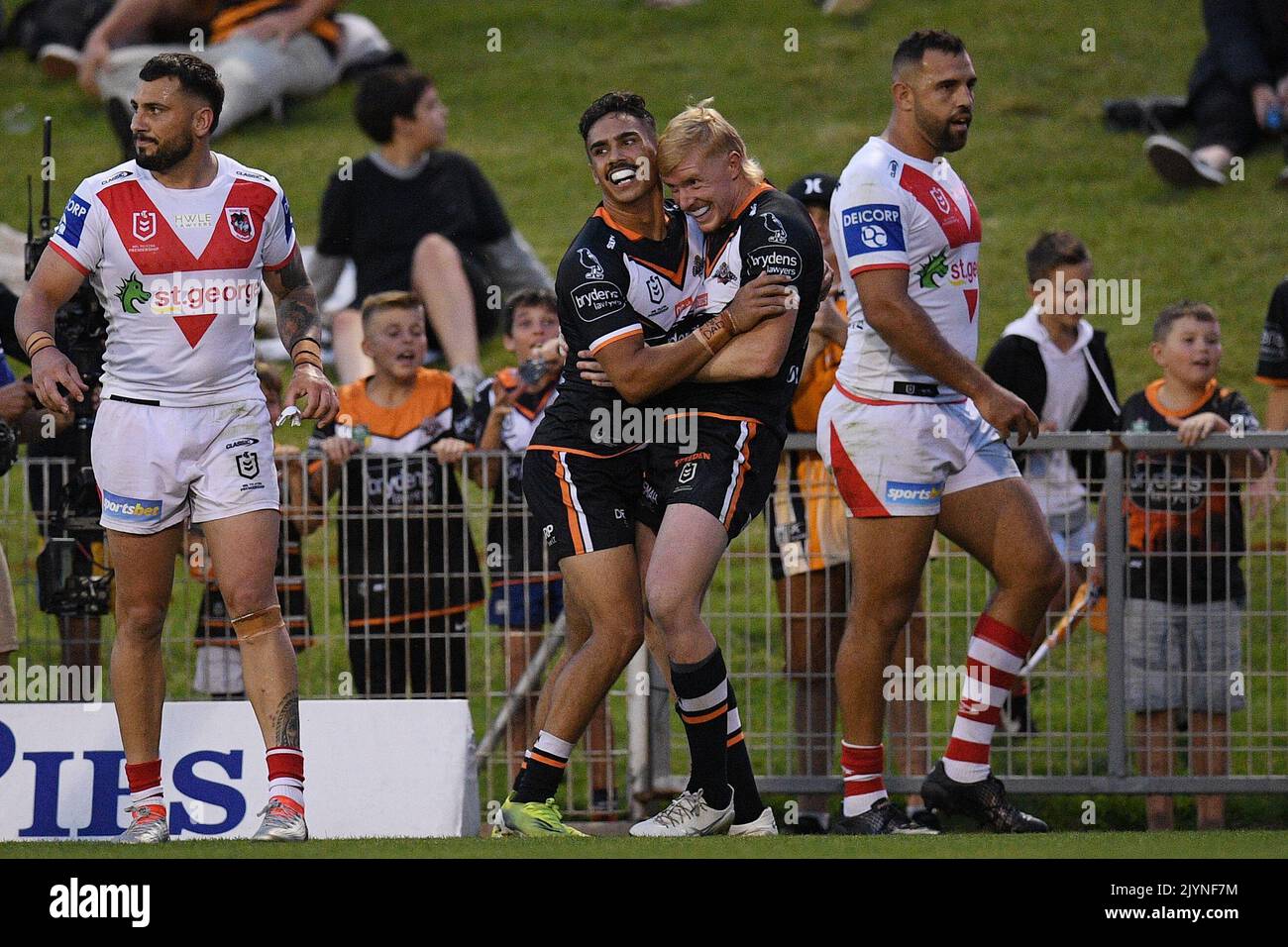 Zac Cini of the Tigers celebrates after scoring a try on debut during ...