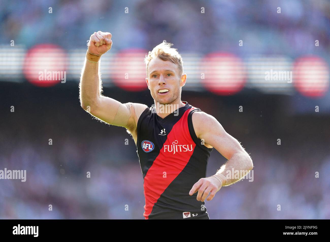 Nick Hind of the Bombers celebrates after kicking a goal which was ...