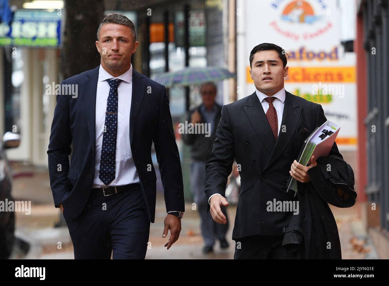 Former NRL player Sam Burgess (left) arrives with his lawyer Brian ...