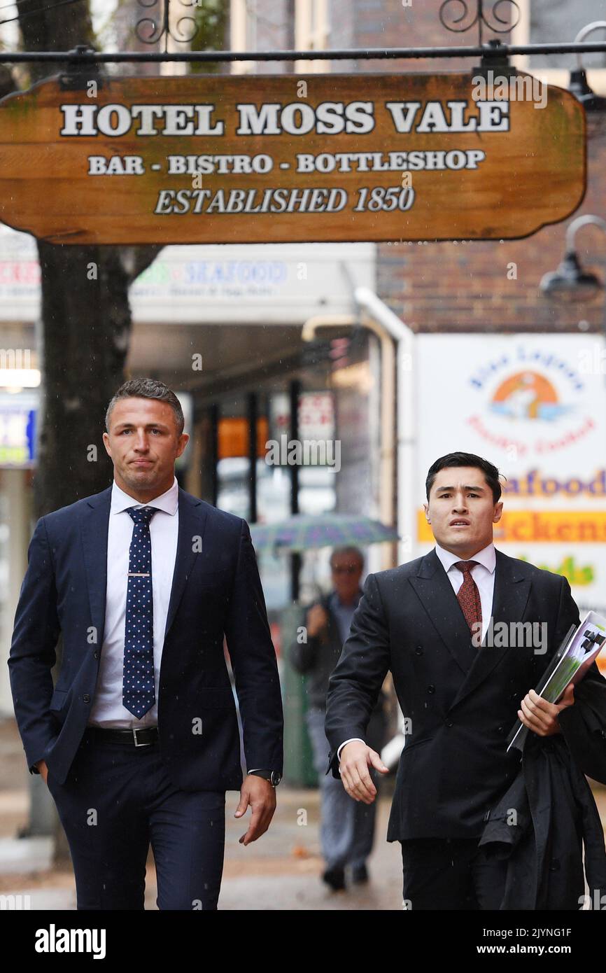 Former NRL player Sam Burgess (left) arrives with his lawyer Brian ...
