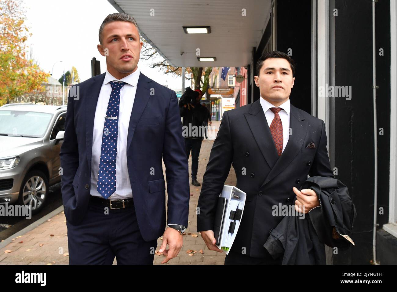 Former NRL player Sam Burgess (left) arrives with his lawyer Brian ...