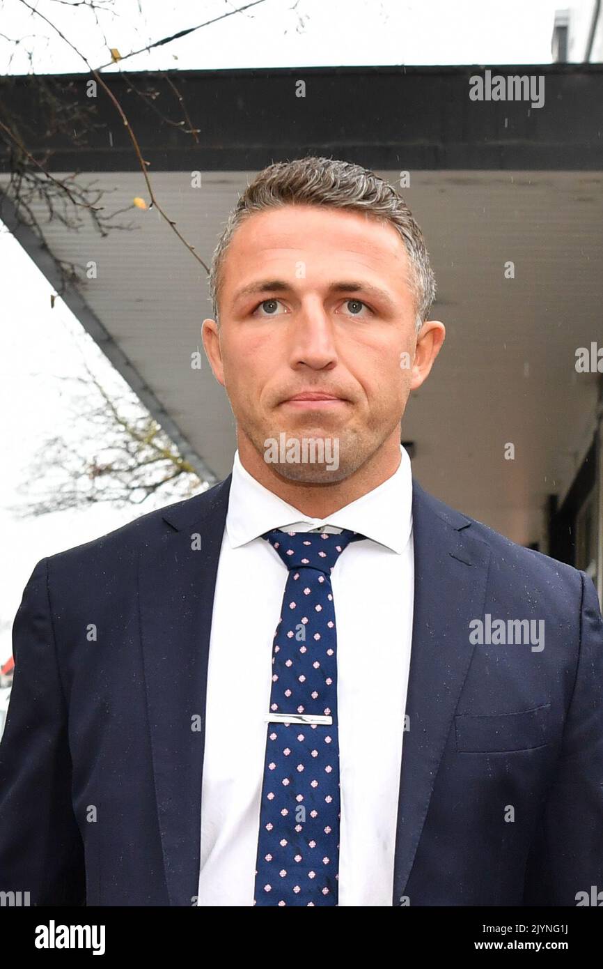Former NRL player Sam Burgess (left) arrives with his lawyer Brian ...