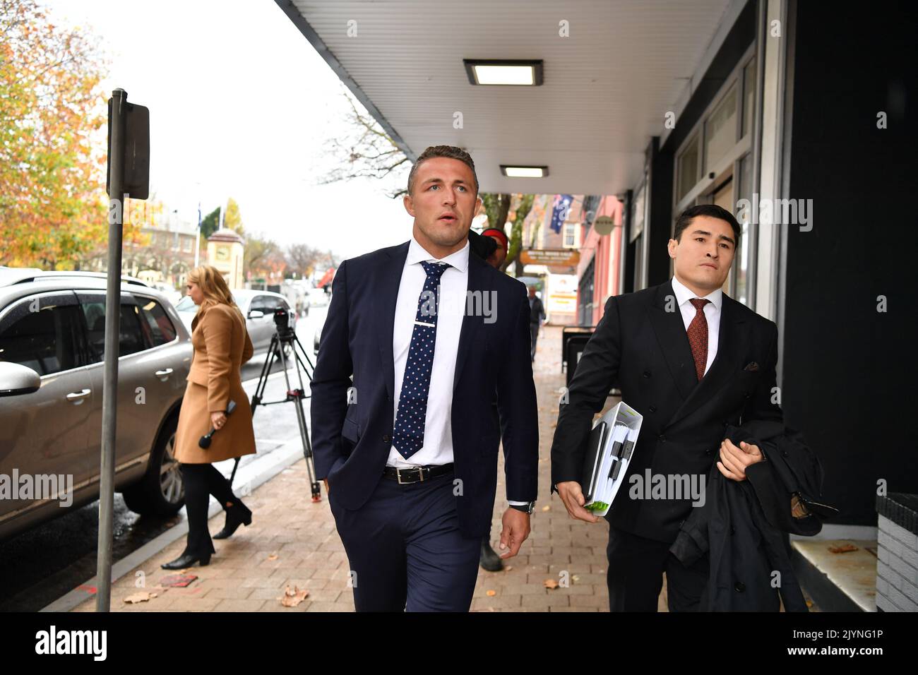 Former NRL player Sam Burgess (left) arrives with his lawyer Brian ...