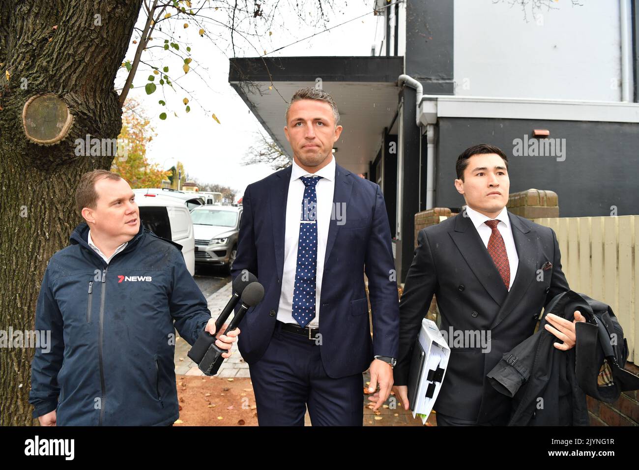 Former NRL player Sam Burgess (left) arrives with his lawyer Brian ...