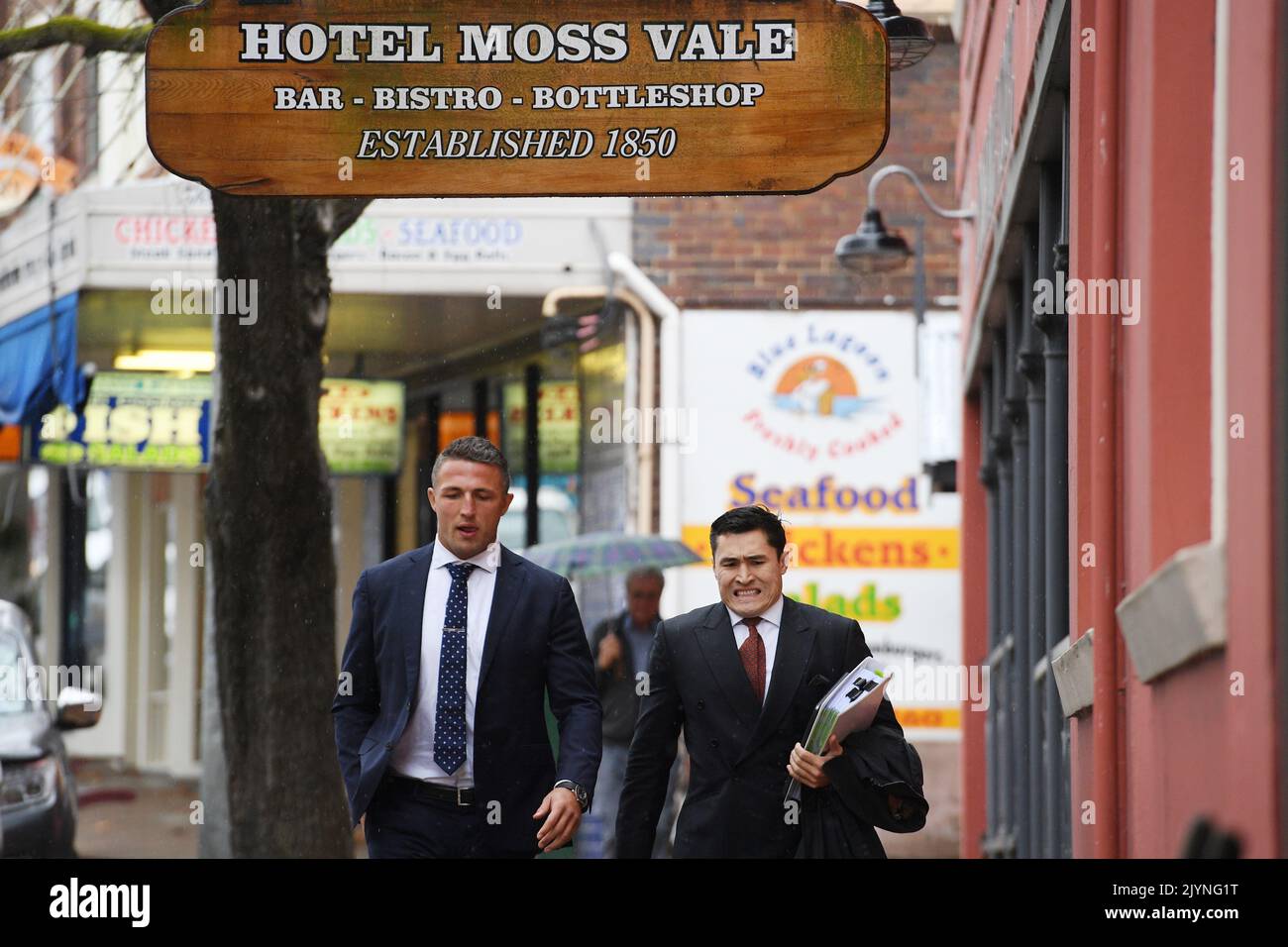 Former NRL player Sam Burgess (left) arrives with his lawyer Brian ...