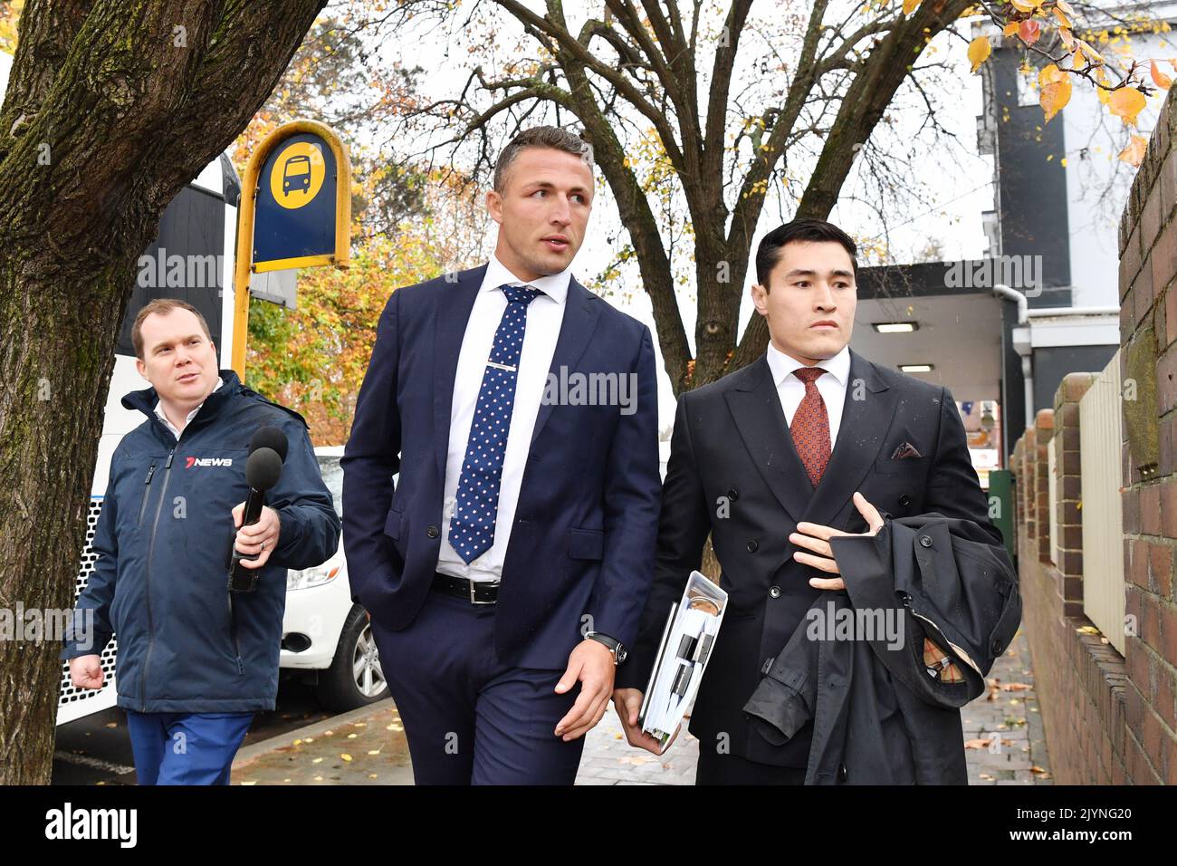 Former NRL player Sam Burgess (left) arrives with his lawyer Brian ...