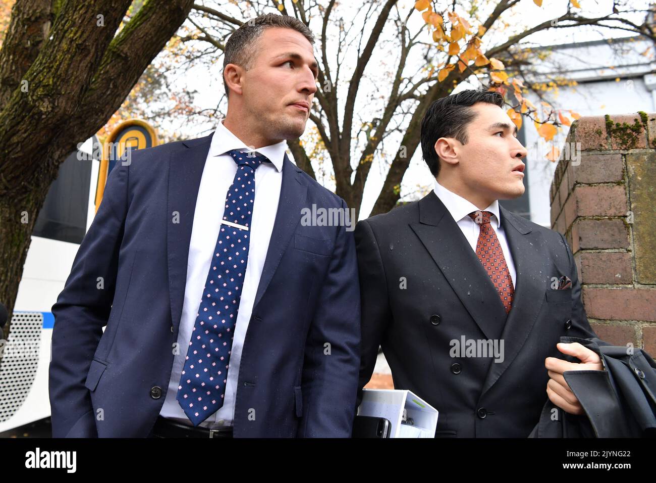 Former NRL player Sam Burgess (left) arrives with his lawyer Brian ...