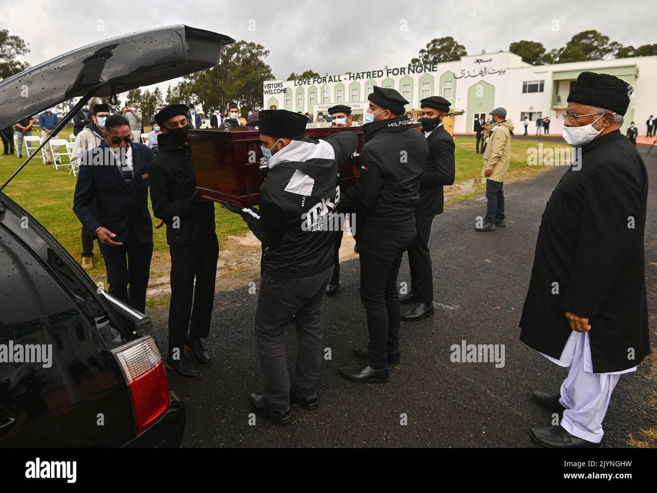 The casket of Ayaz Younus is carried into a hearse at Masjid Baitul ...