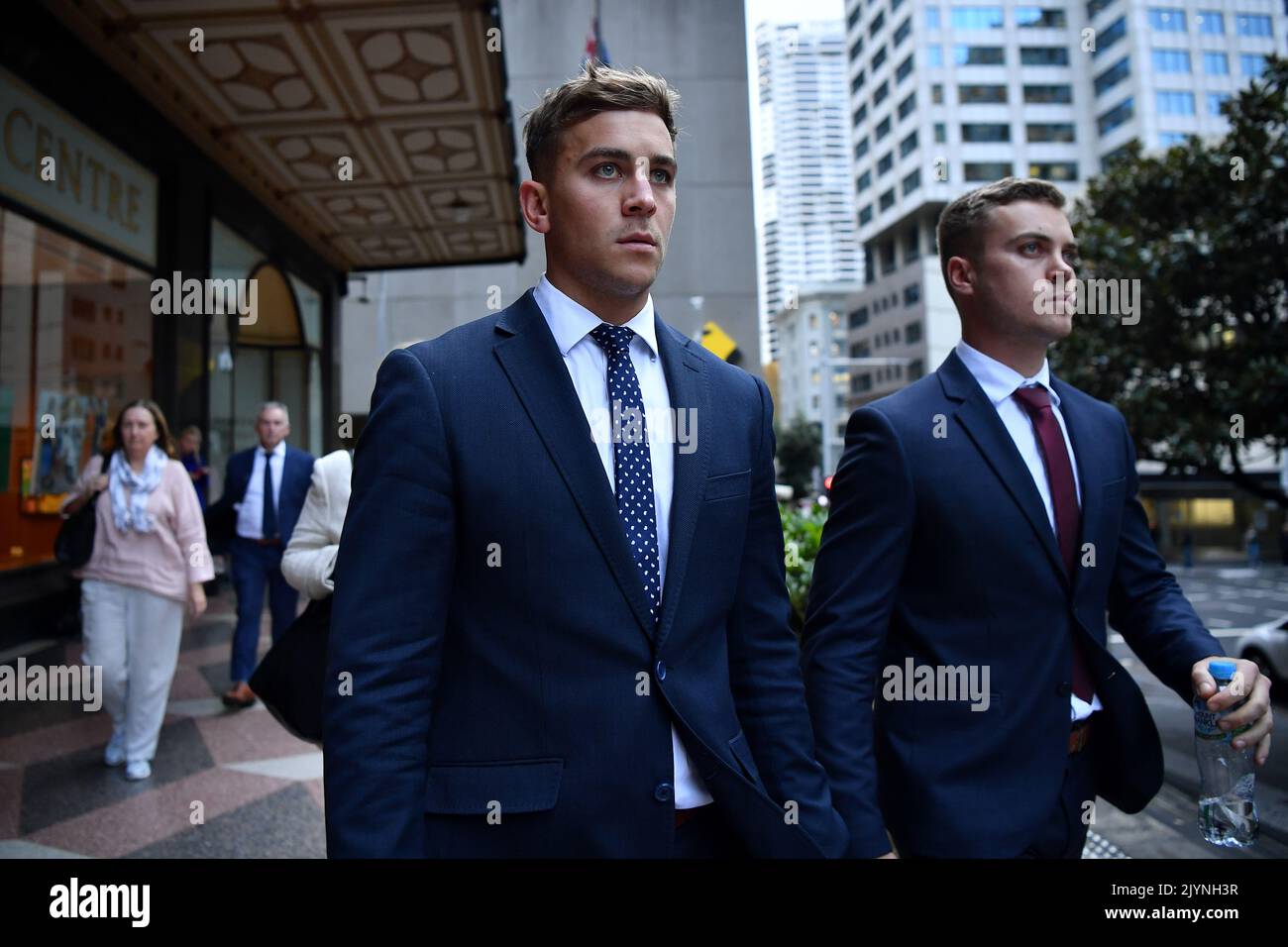 Rugby League player Callan Sinclair (left) leaves the Downing Centre ...
