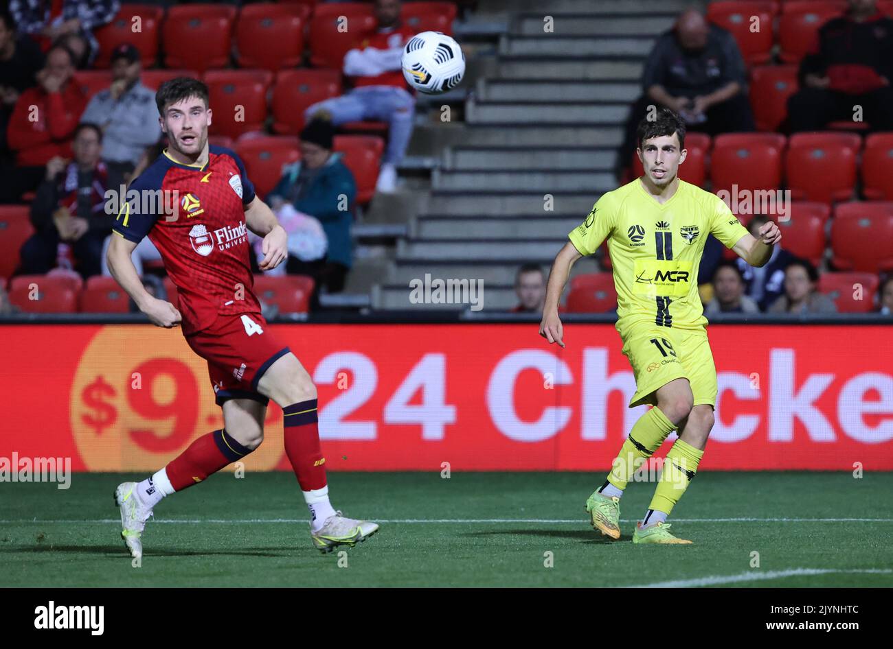 Ryan Strain of United and Sam Sutton of the Phoenix during the A-League ...