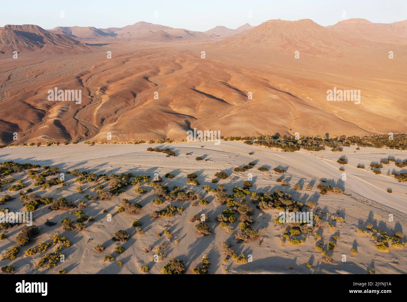The dry bed of the Hoarusib river and adjoining badlands. Bottom an ...