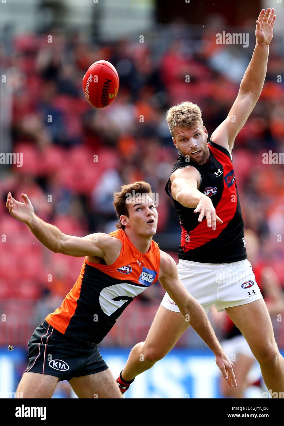 Jake Stringer of the Bombers contests the ball with Jack Buckley of the ...