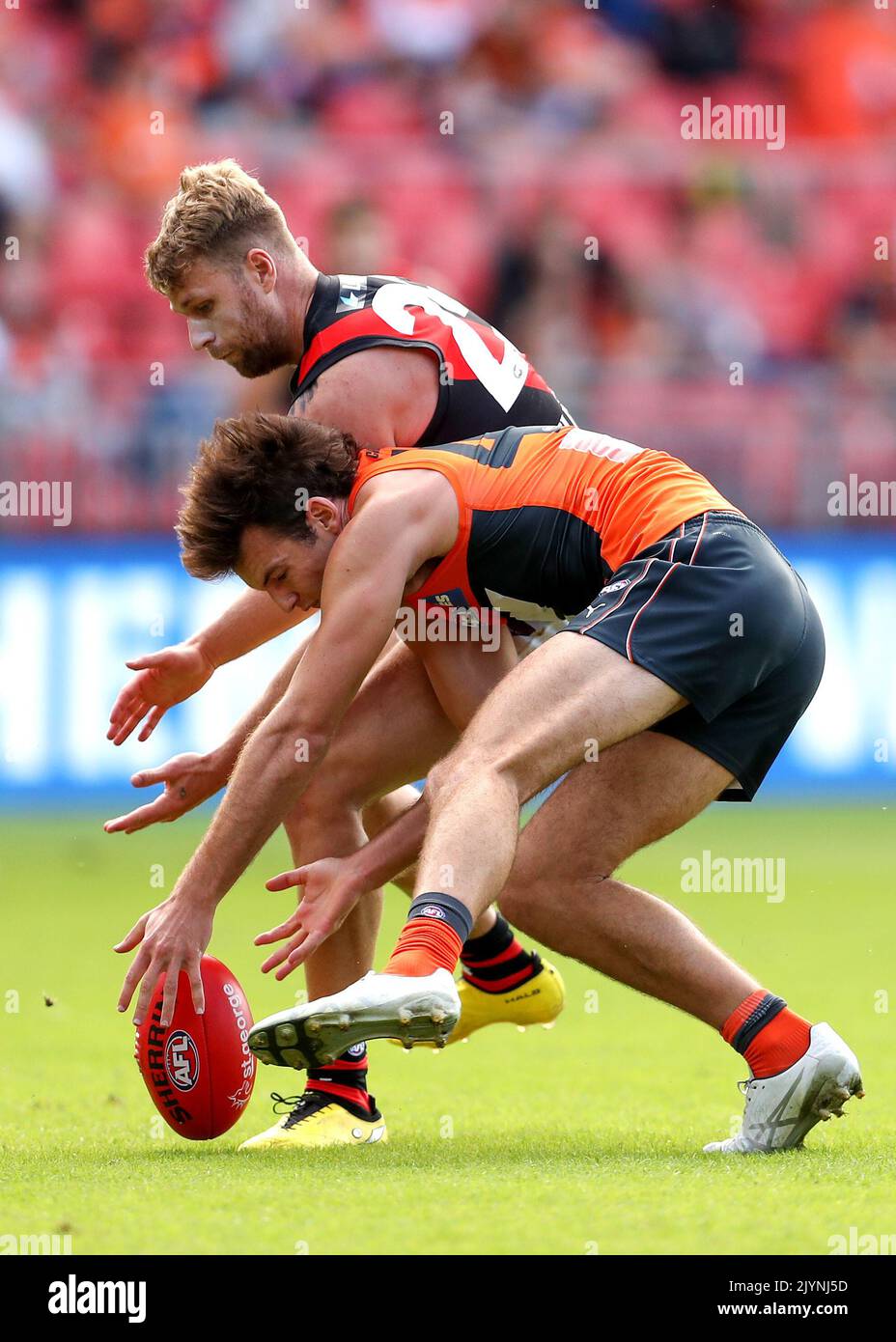 Jake Stringer of the Bombers contests the ball with Jack Buckley of the ...