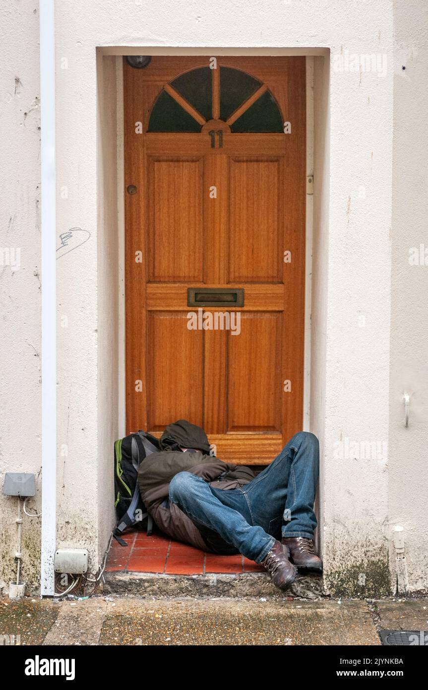 Brighton, February 28th 2015: A homeless person sleeping in a doorway ...